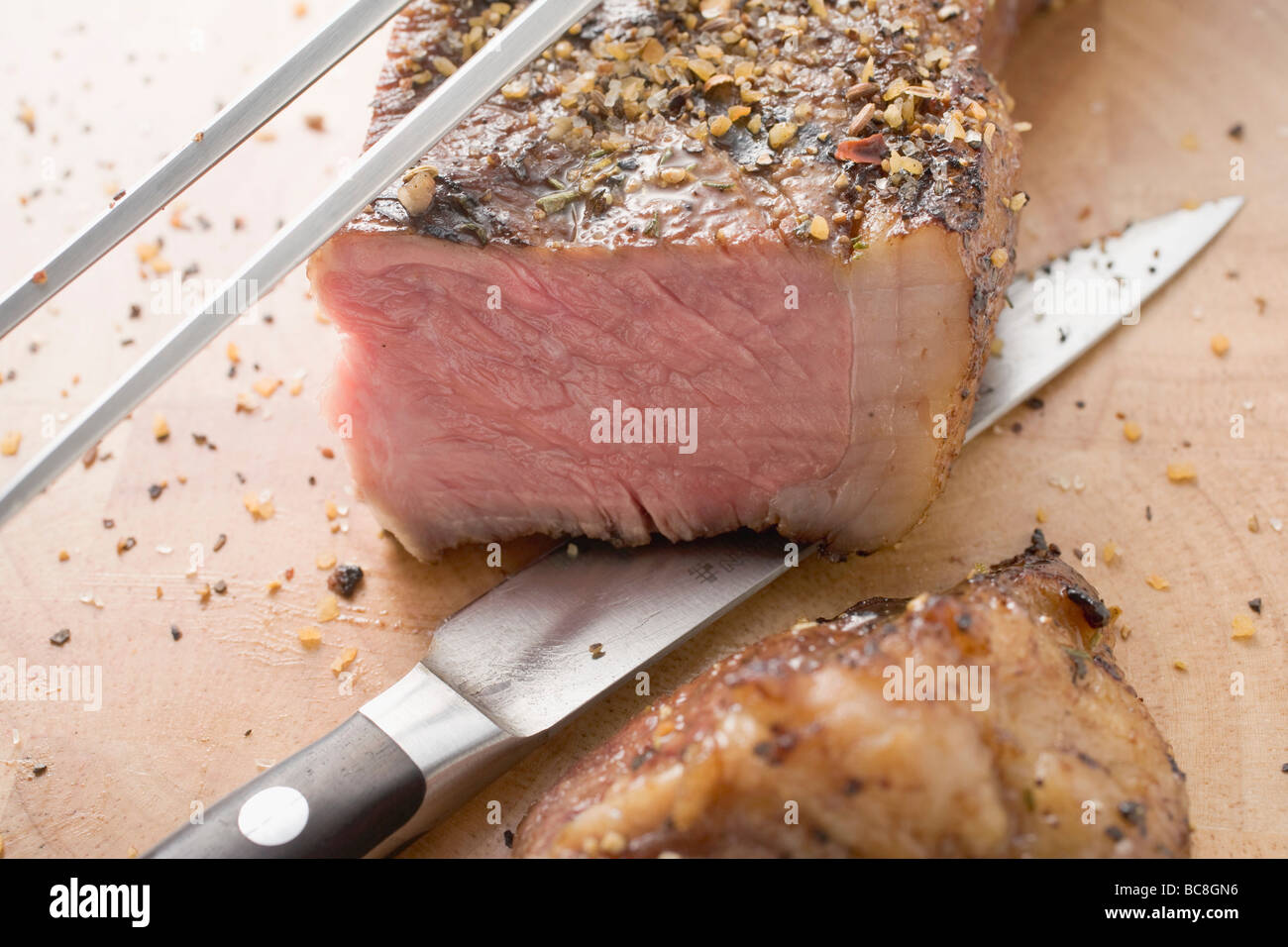 Cutting beef off hi-res stock photography and images - Alamy