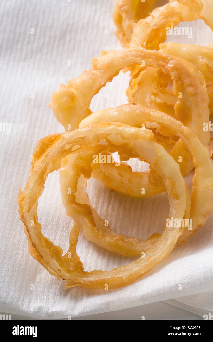 Deep-fried onion rings on kitchen paper (close-up Stock Photo - Alamy