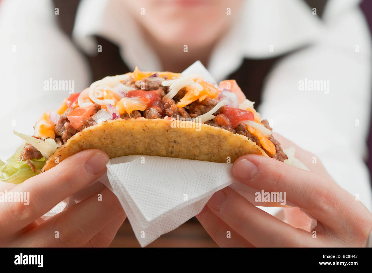 Hand holding taco filled hi-res stock photography and images - Alamy