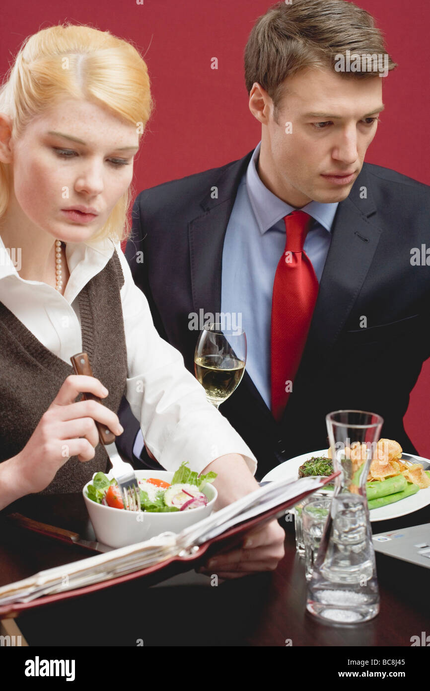 Stressed office colleagues working through lunch Stock Photo - Alamy