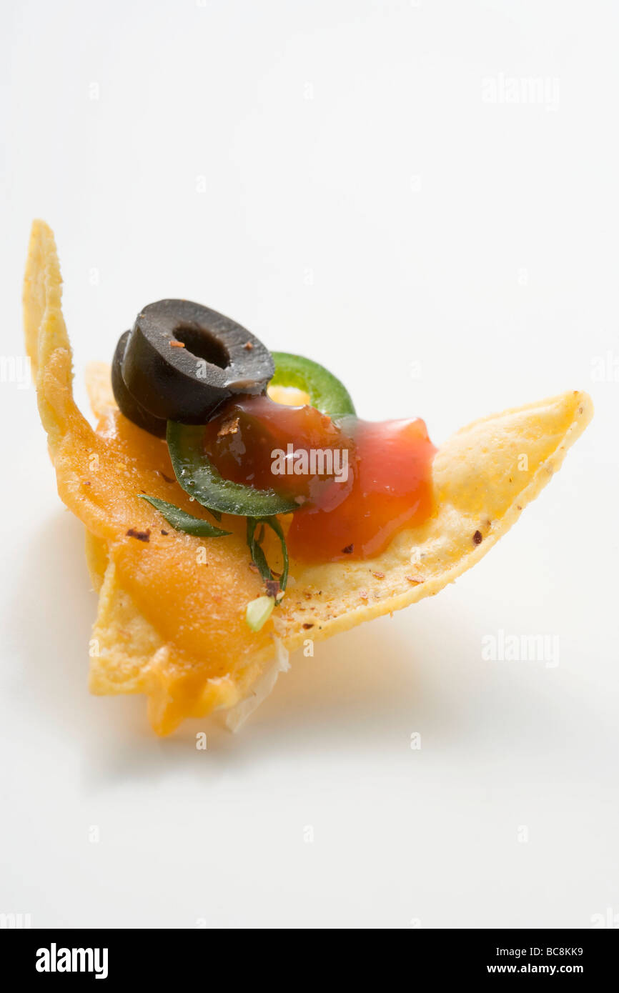 Nacho with cheese, olive, chilli ring and ketchup Stock Photo - Alamy