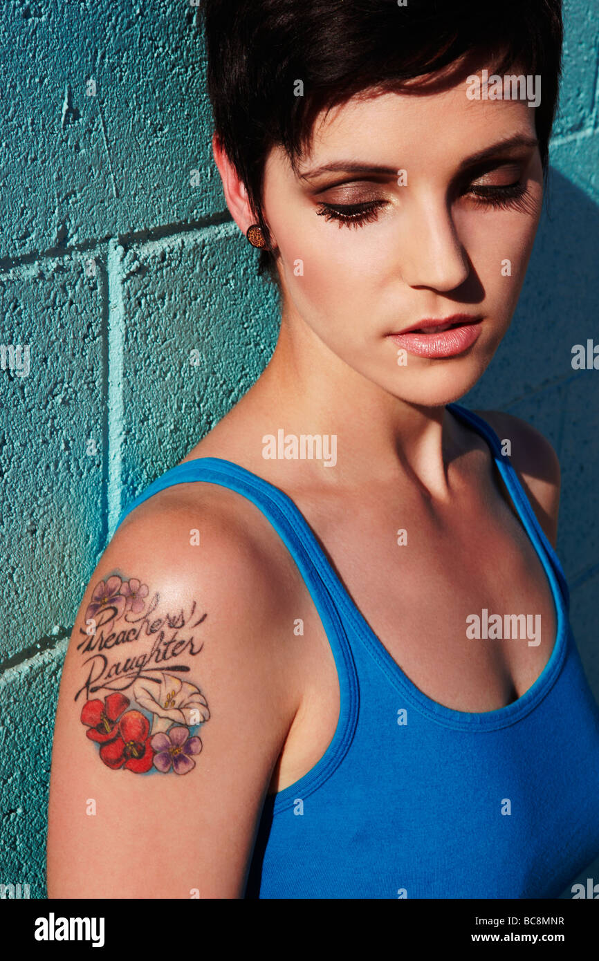 Female leaning against rock hi-res stock photography and images - Alamy