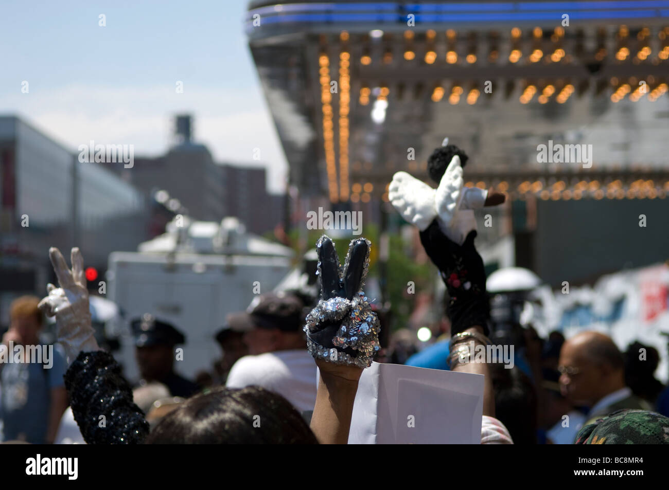 Thousands of Michael Jackson fans gather outside the Apollo Theater in ...