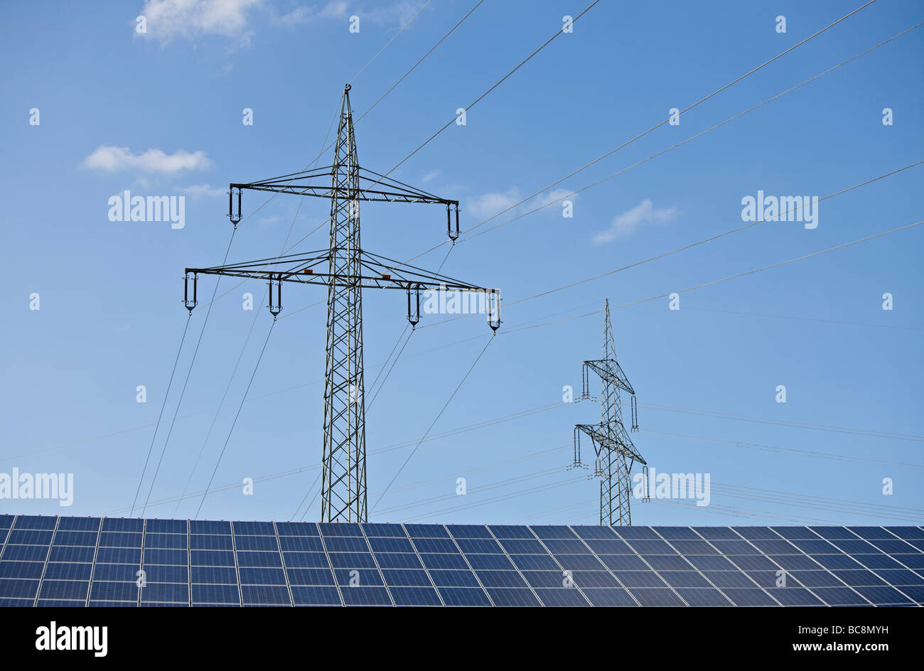 solar panels and a pylon on a sunny day Stock Photo - Alamy