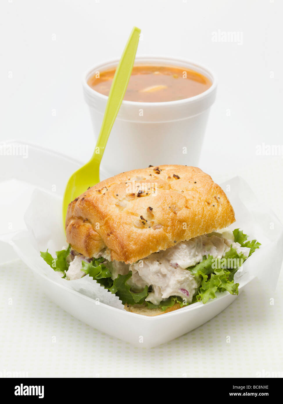 Chicken salad sandwich in polystyrene container, tomato soup Stock ...