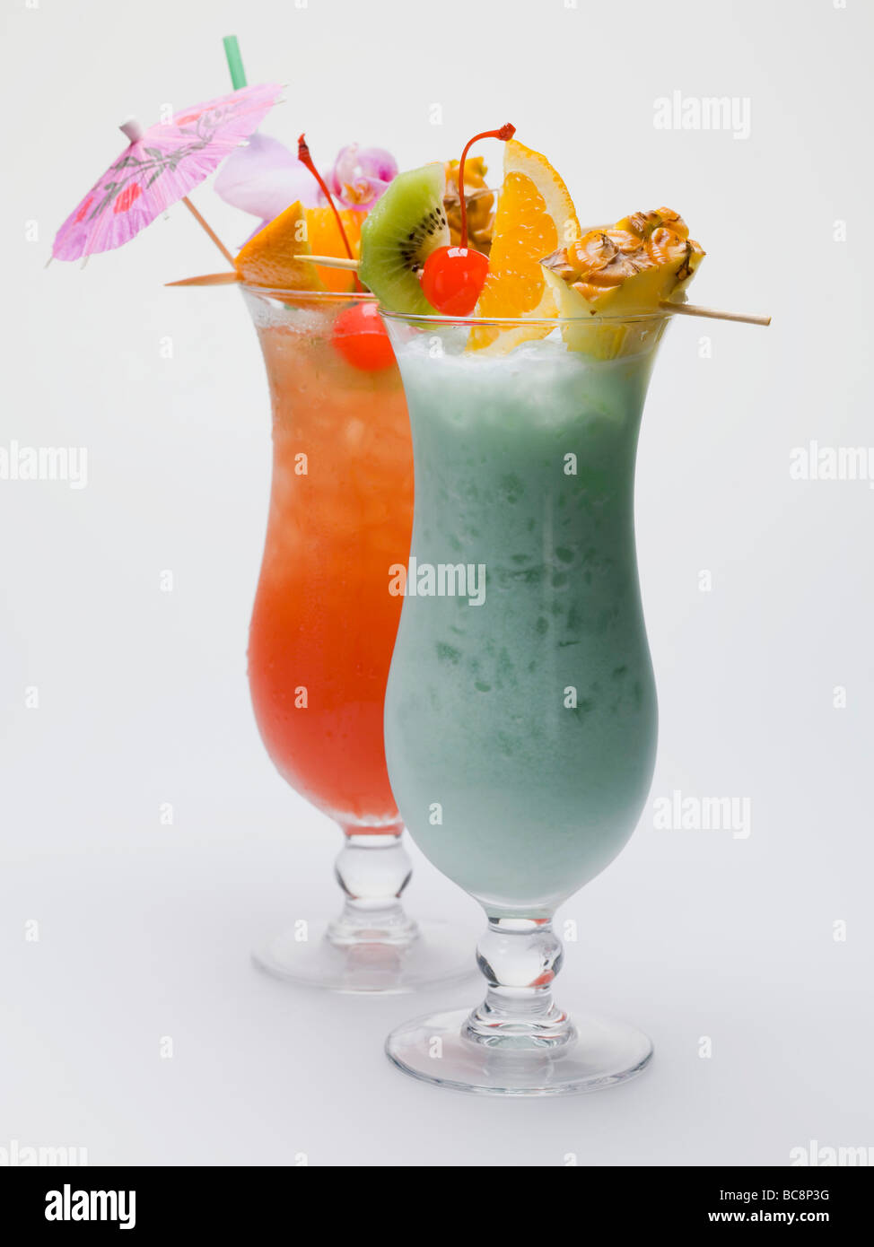 Two Caribbean long drinks with fruit skewers Stock Photo - Alamy