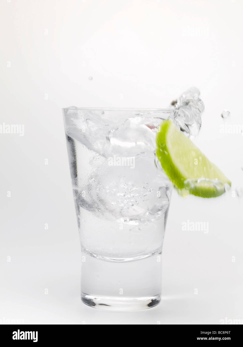 Water splashing out of a glass Stock Photo - Alamy