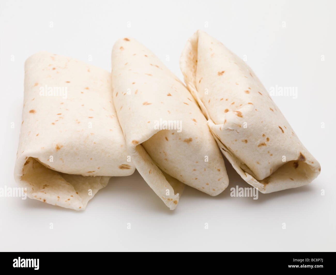 Three tortilla parcels Stock Photo - Alamy