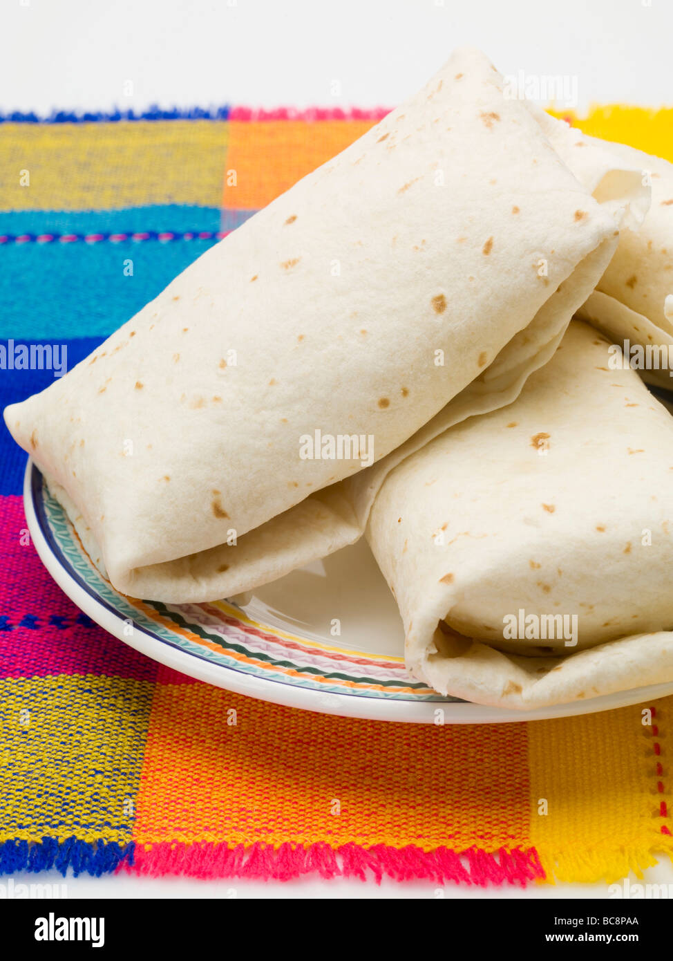 Several tortilla parcels on plate Stock Photo - Alamy