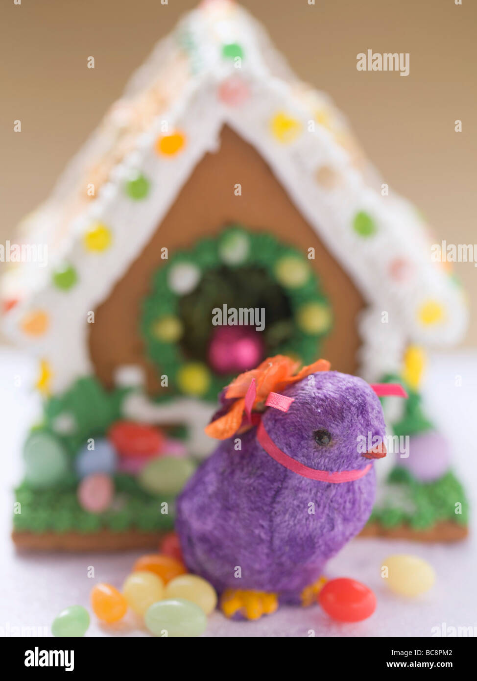 Gingerbread house for Easter and purple chick Stock Photo - Alamy