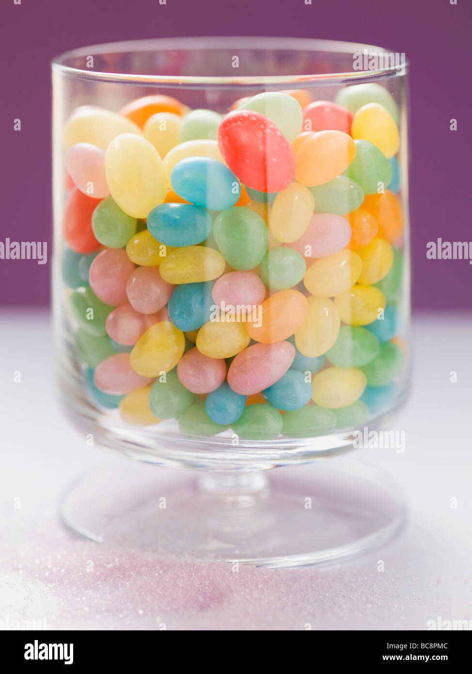 Coloured jelly beans in glass Stock Photo - Alamy