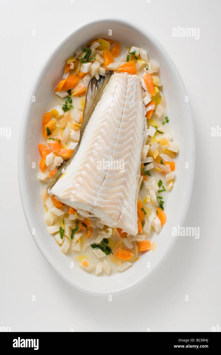 Fish on root vegetables (overhead view Stock Photo - Alamy