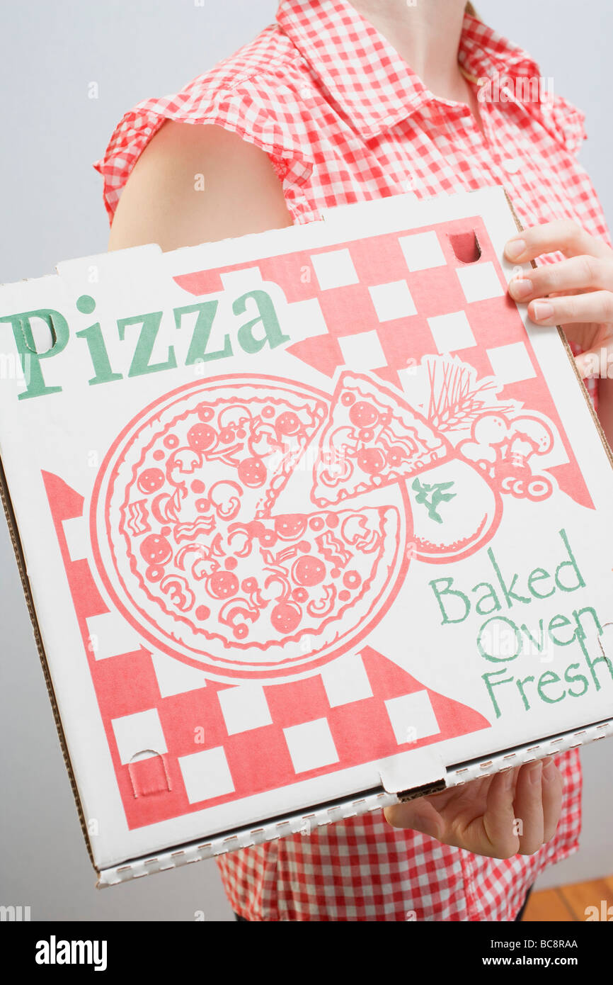 Woman holding pizza box Stock Photo - Alamy
