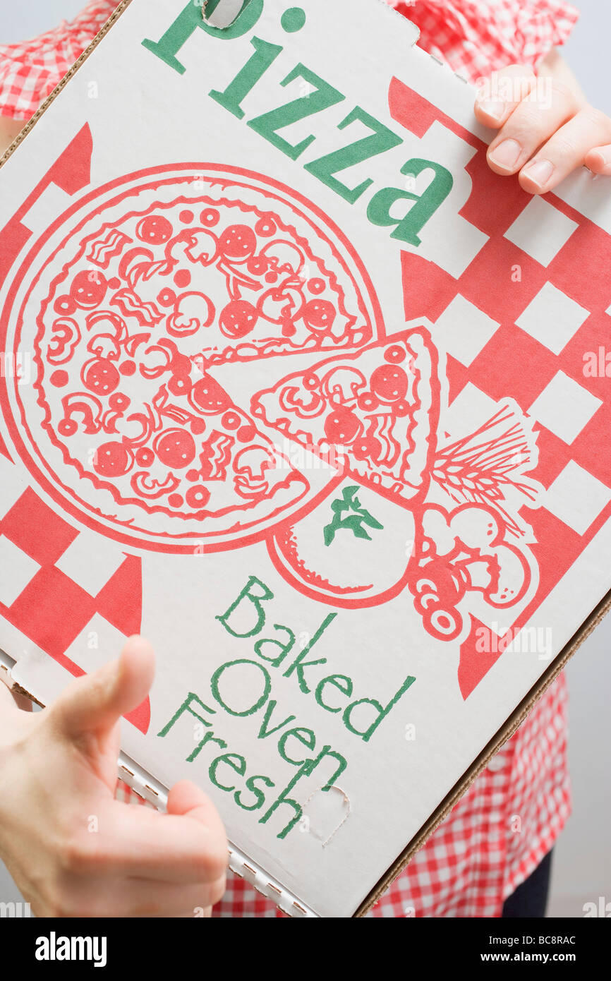 Woman holding pizza box (close-up Stock Photo - Alamy