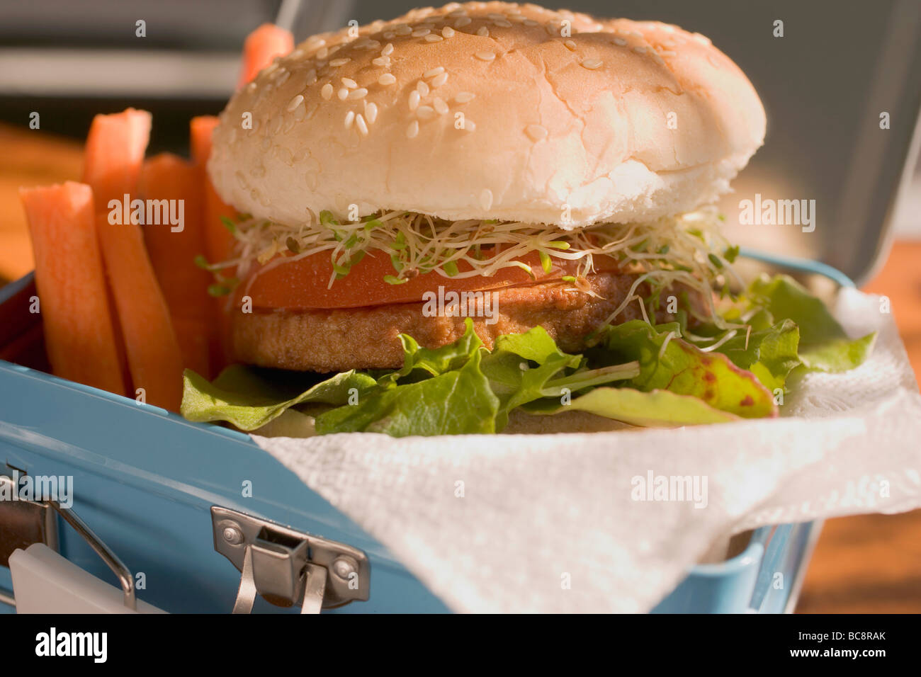 Burger and vegetables in lunch box Stock Photo - Alamy