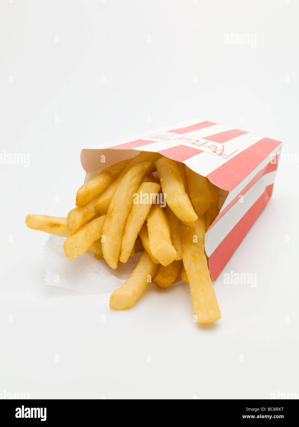 Chips in a striped carton, lying on its side Stock Photo - Alamy