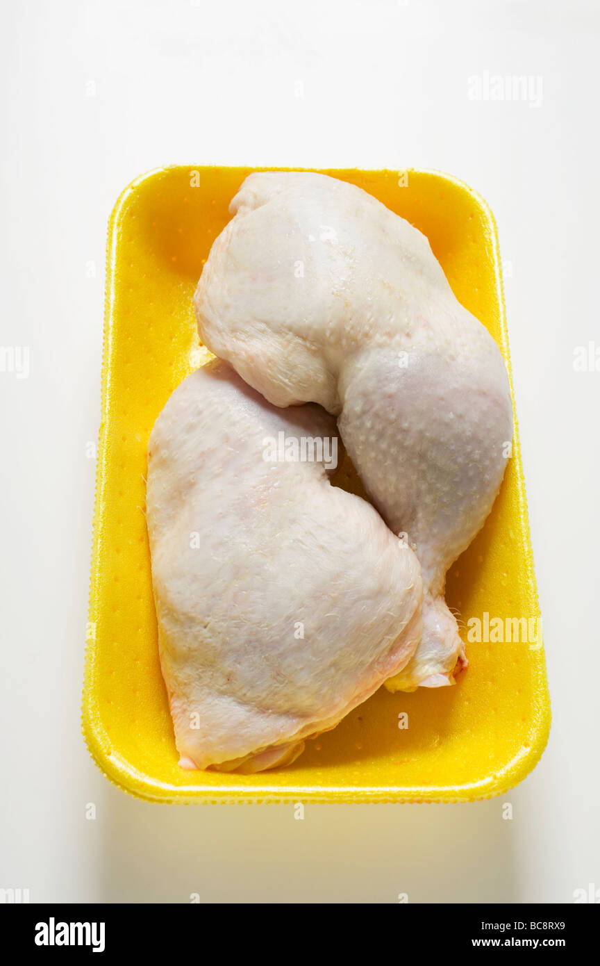 Two fresh chicken legs in polystyrene tray Stock Photo - Alamy