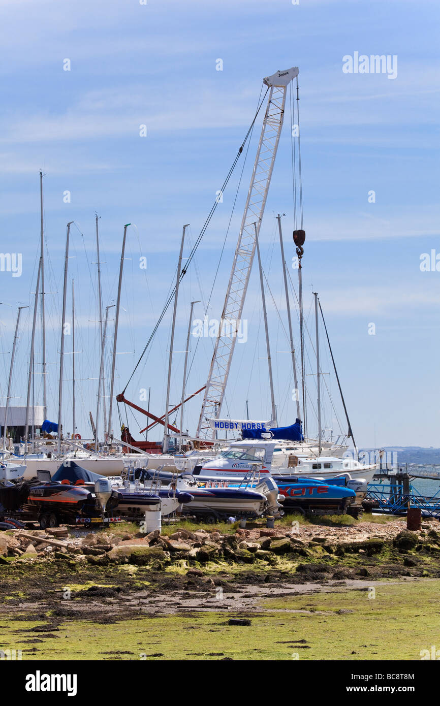 Boatyard at Warsash with Yachts and RIBs stored ashore and a crane for ...