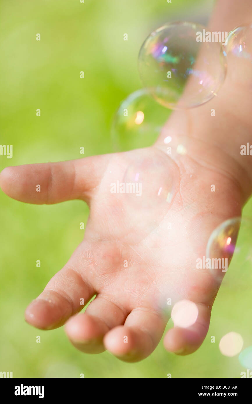 Child's hand with bubbles Stock Photo - Alamy