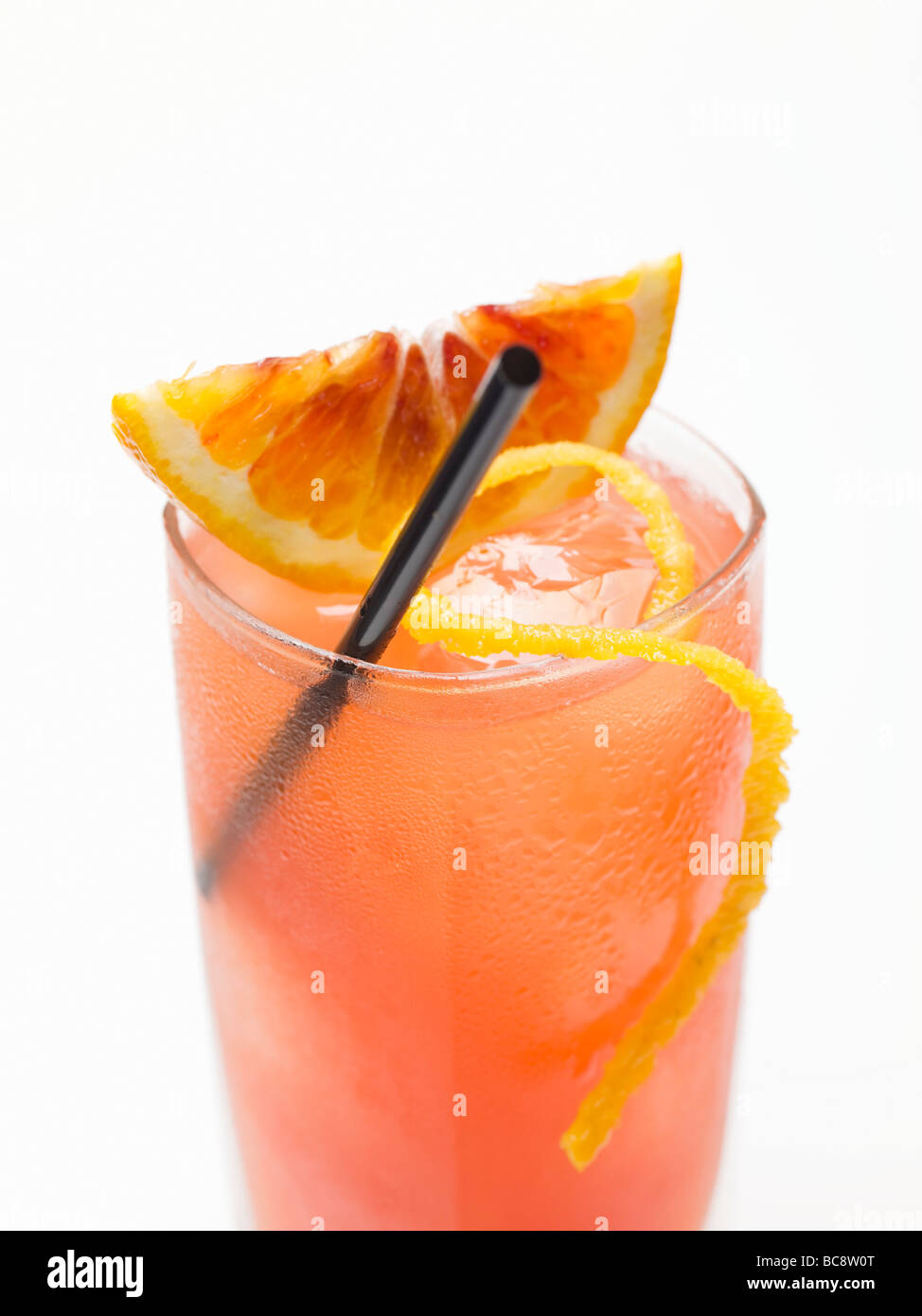 Blood orange drink with ice cubes Stock Photo - Alamy