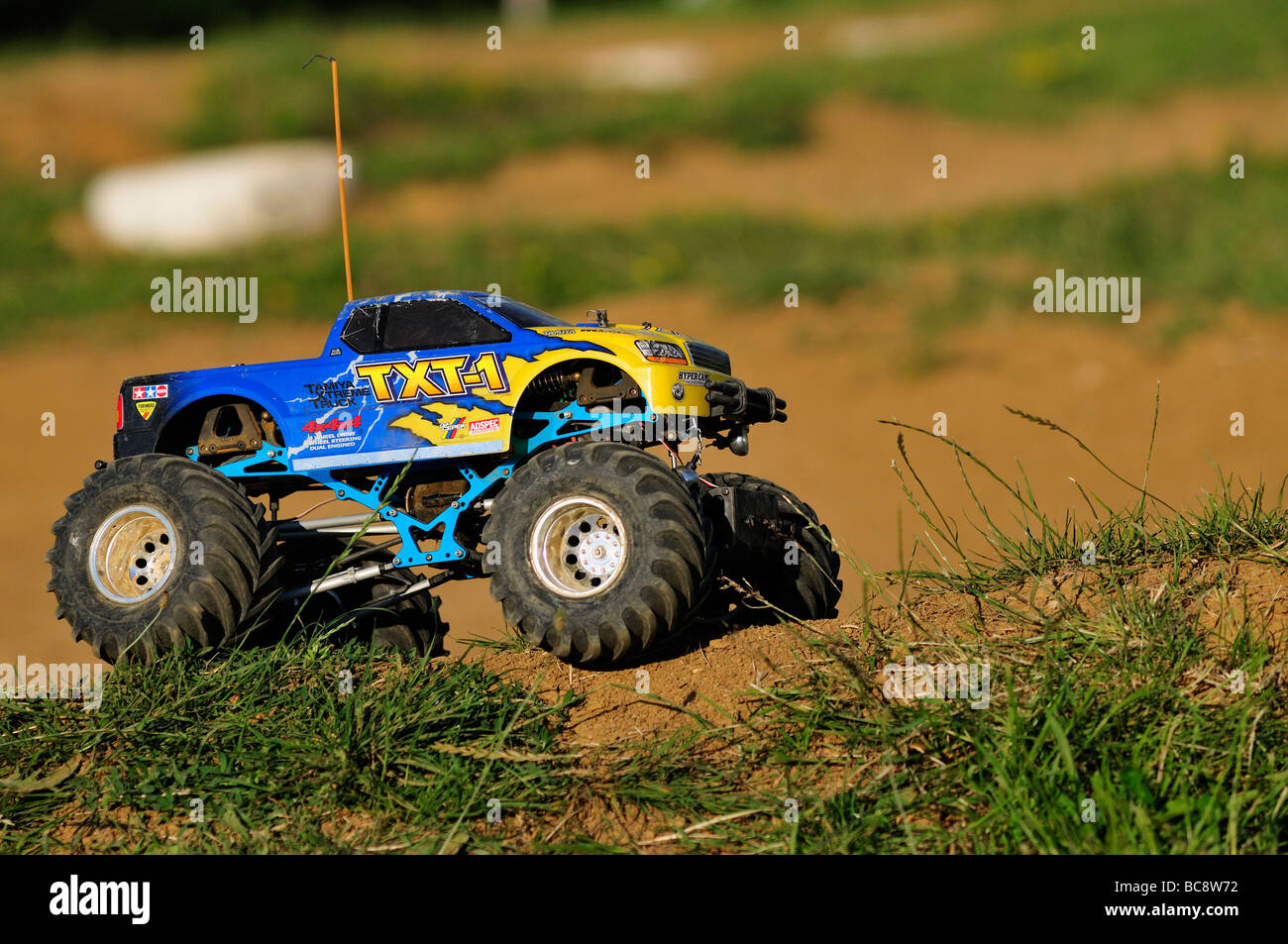 Tamiya toy radio controlled Monster Truck speeding and jumping Stock ...