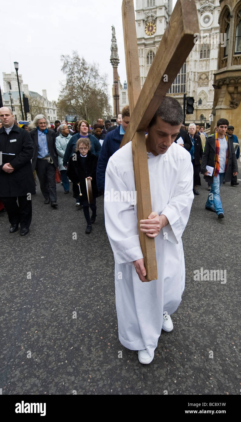 Man carrying a cross in Westminster London Stock Photo - Alamy