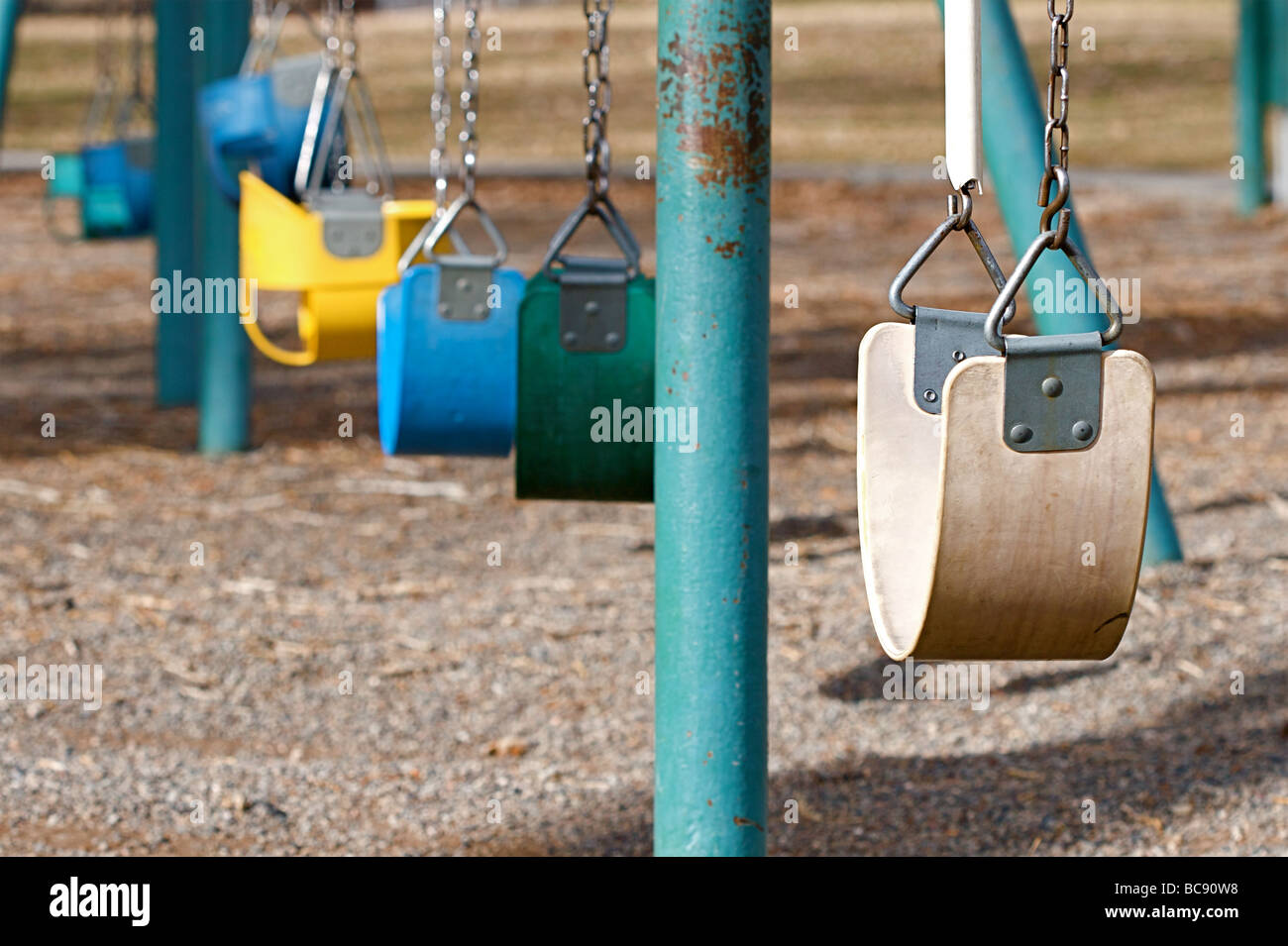 Elements of a swing set at a cold autumn play ground Stock Photo - Alamy