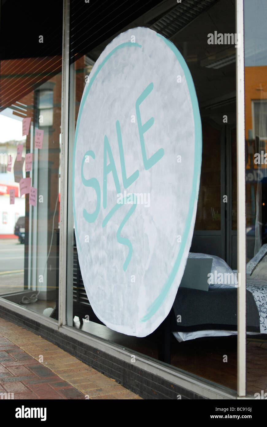 Sale sign in shop window Stock Photo - Alamy