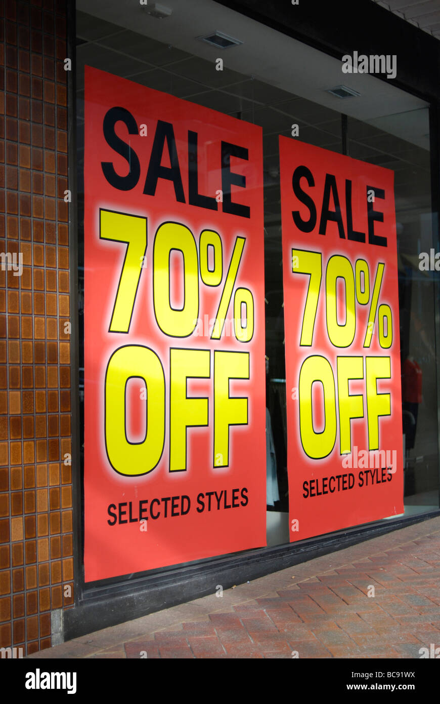 Sale sign in shop window Stock Photo - Alamy