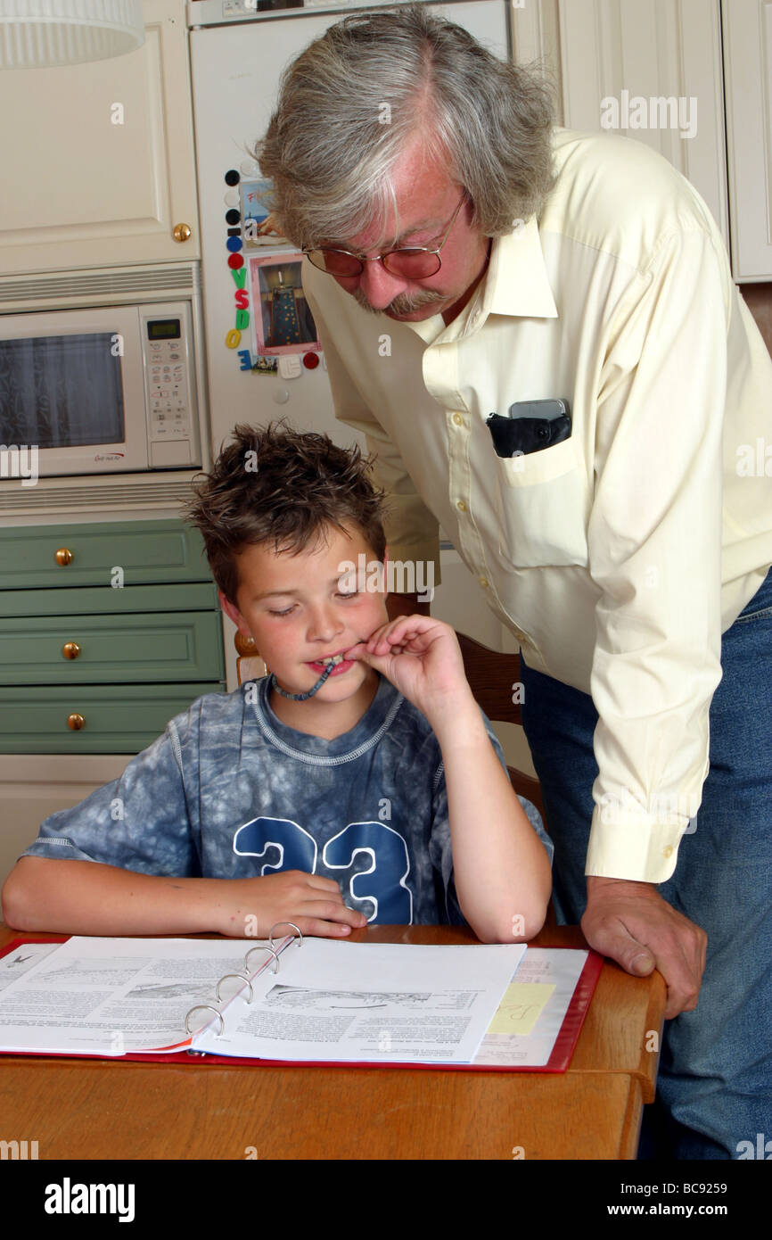 Father helping child with homework Stock Photo - Alamy