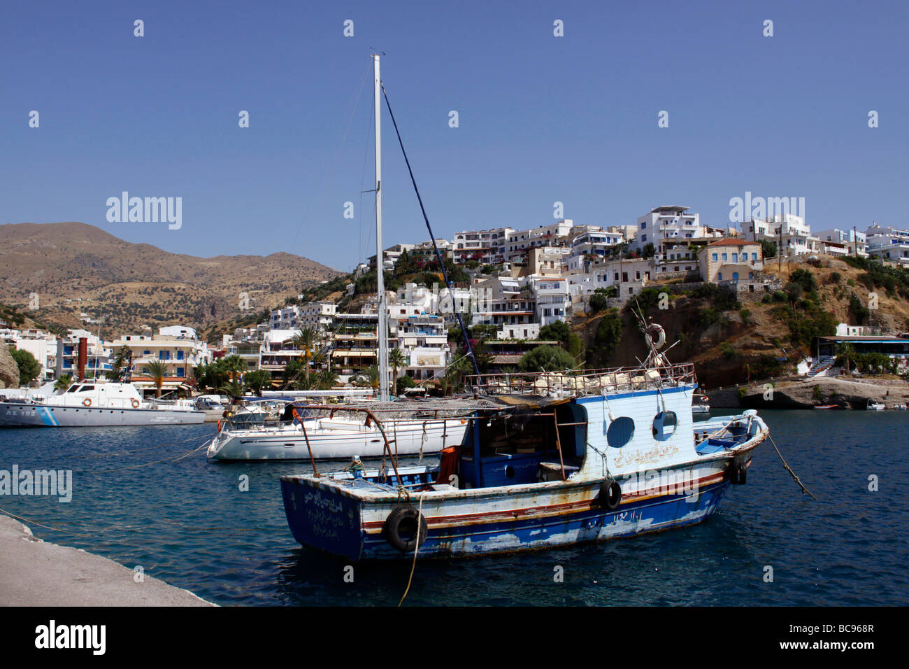 THE NOSTALGIC PICTURESQUE HARBOUR AND QUAYSIDE OF AGIA GALINI ON THE ...