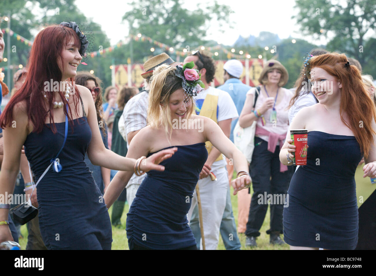 Three women dancing at Glastonbury festival 2009 Stock Photo - Alamy