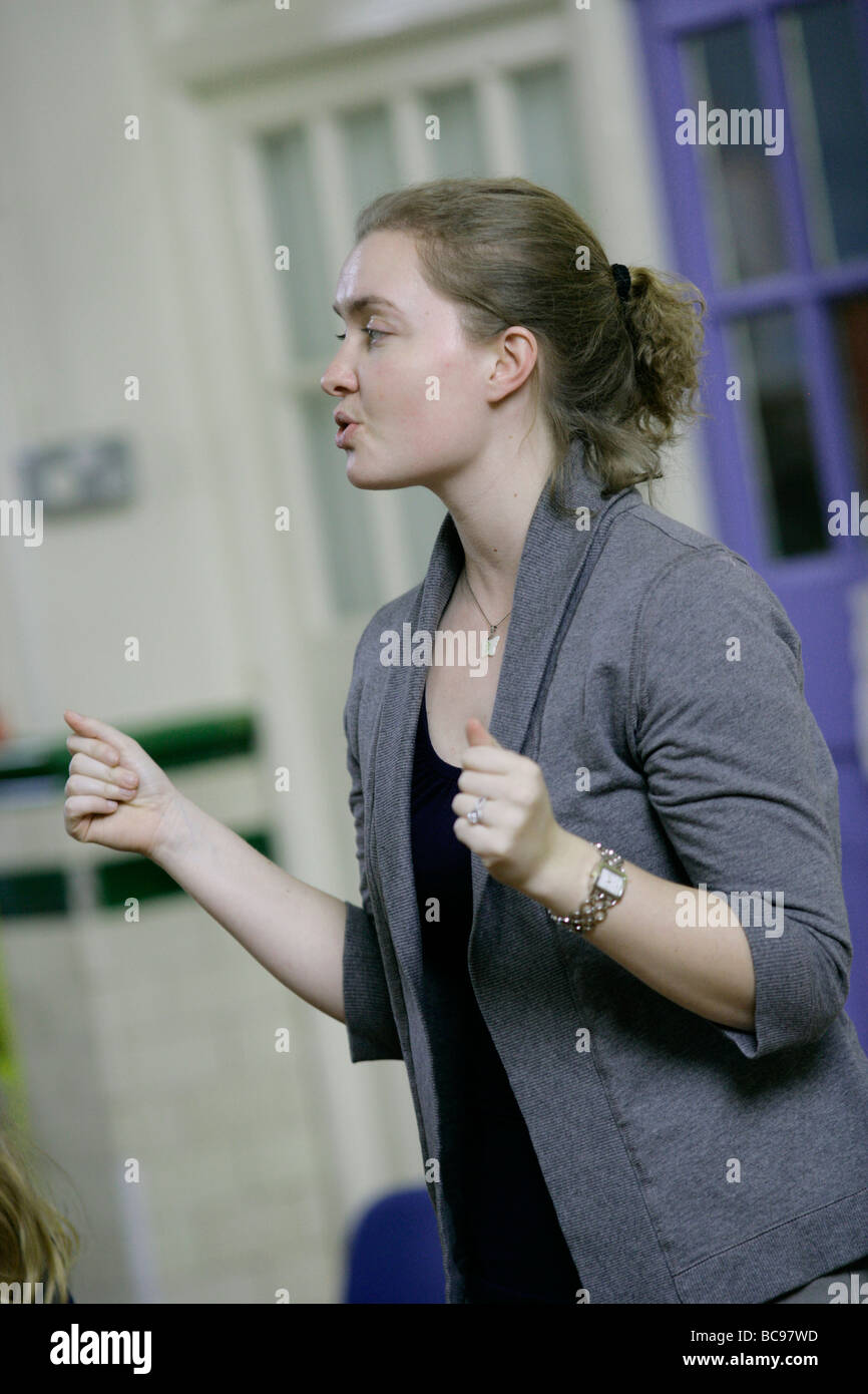 Teacher sInging in a classroom Stock Photo - Alamy