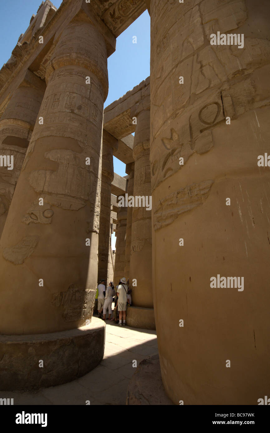 A group of tourists are dwarfed by the huge columns in the Great ...