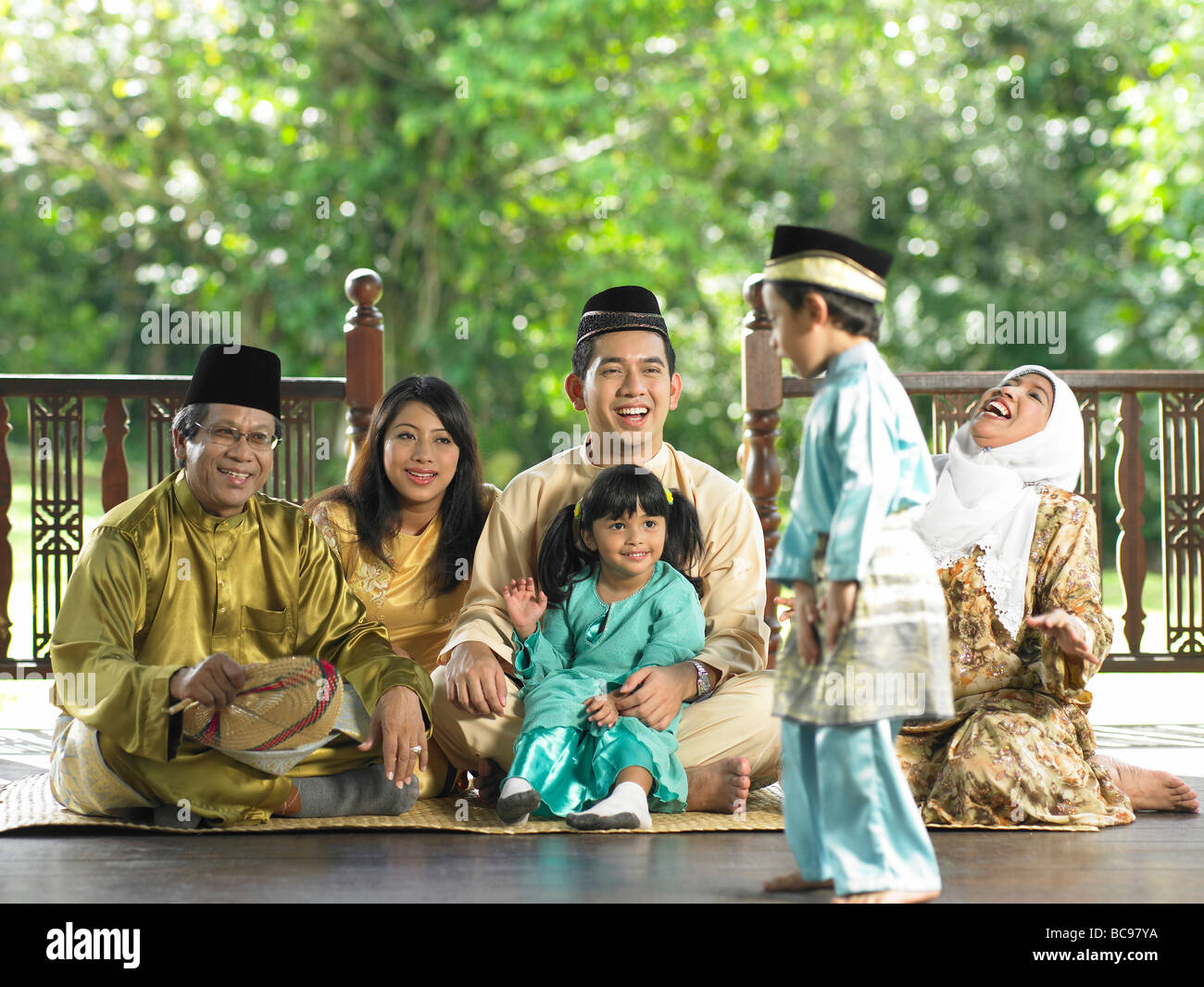 family member sitting together Stock Photo - Alamy