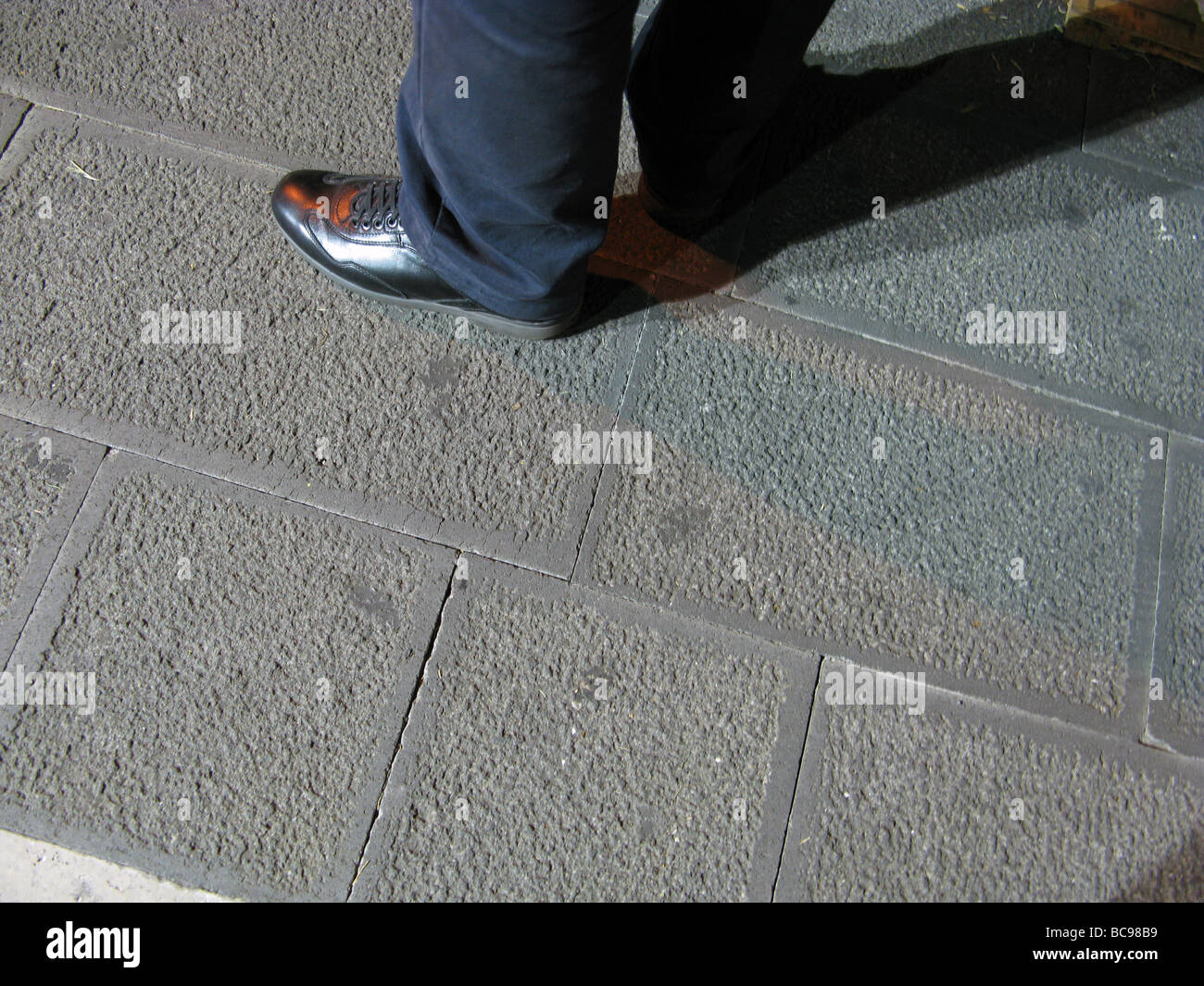 people walking on city street pavement at night Stock Photo - Alamy