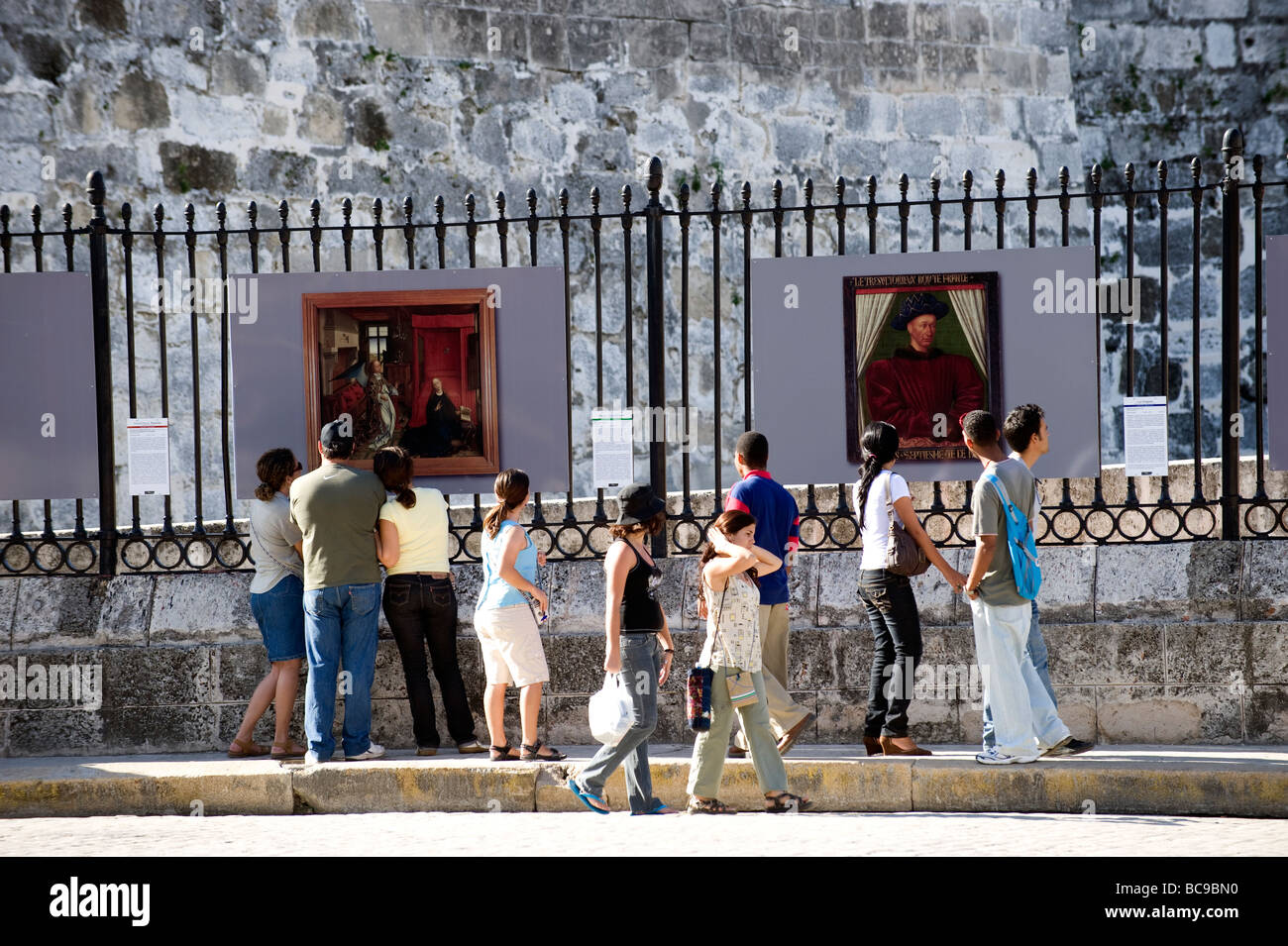 Cubans admiring a travelling exhibit of art in Armoury Square, Havana ...