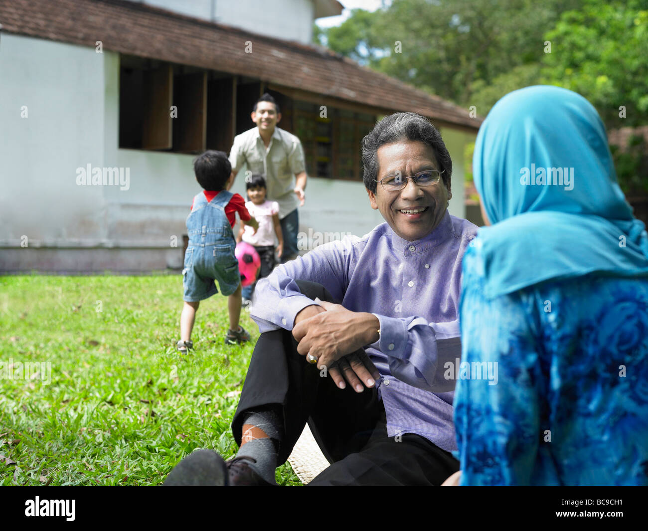 family enjoy playing at back yard Stock Photo - Alamy