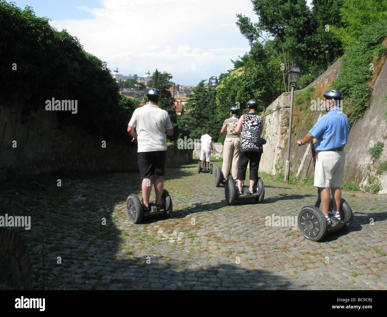 group of tourists on a segway guided tour in rome, italy Stock Photo ...