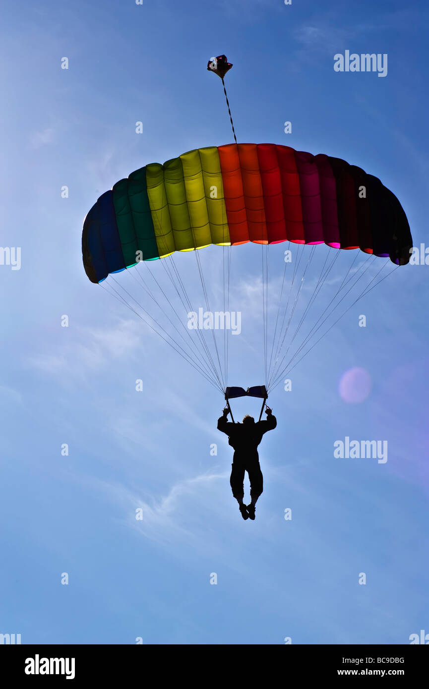 parachutist landing rainbow colored canopy Stock Photo - Alamy