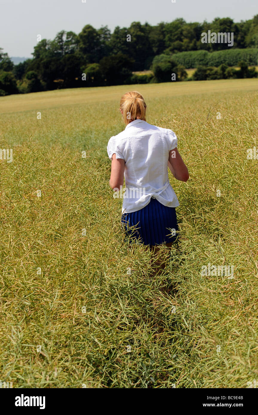 Woman alone walking back view hi-res stock photography and images - Alamy