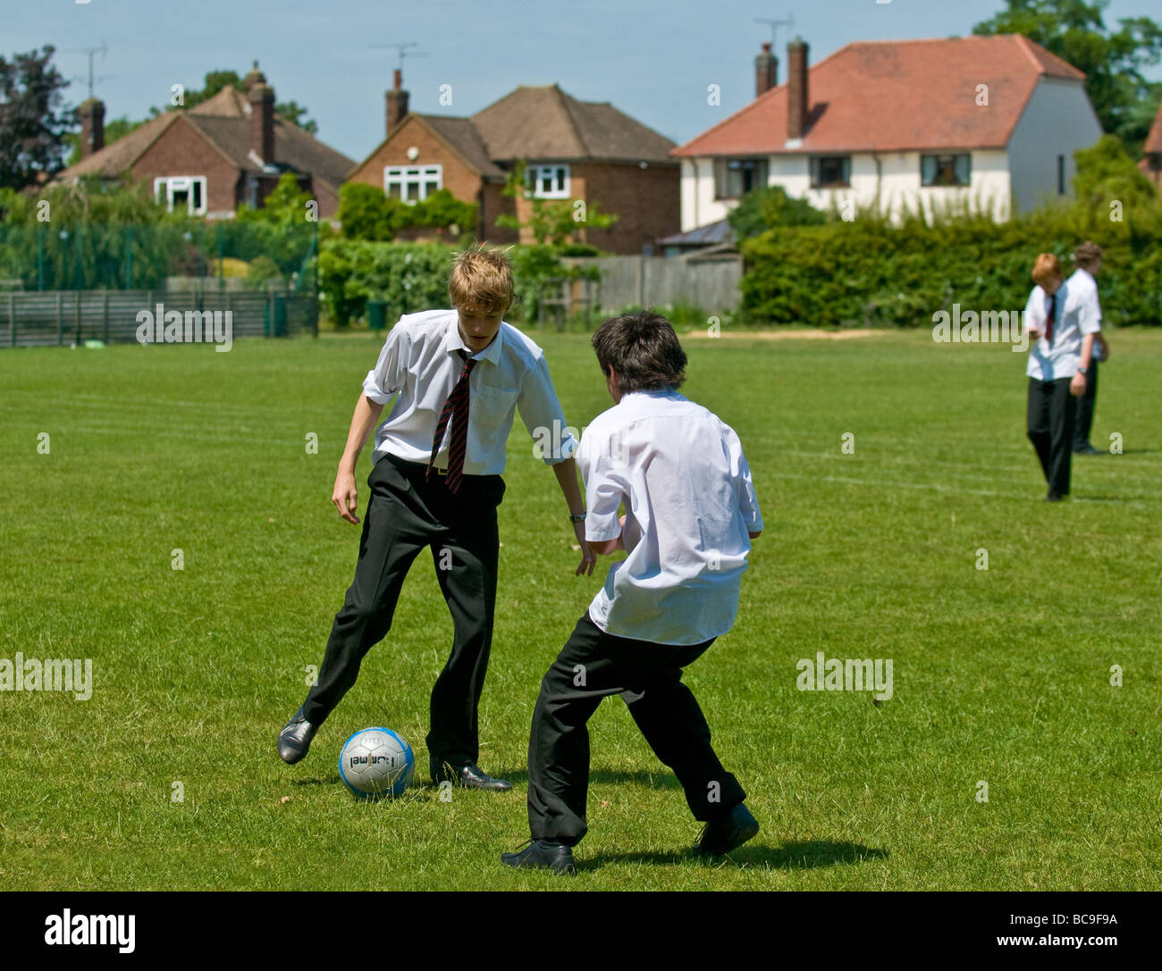 Children playing football field hi-res stock photography and images - Alamy