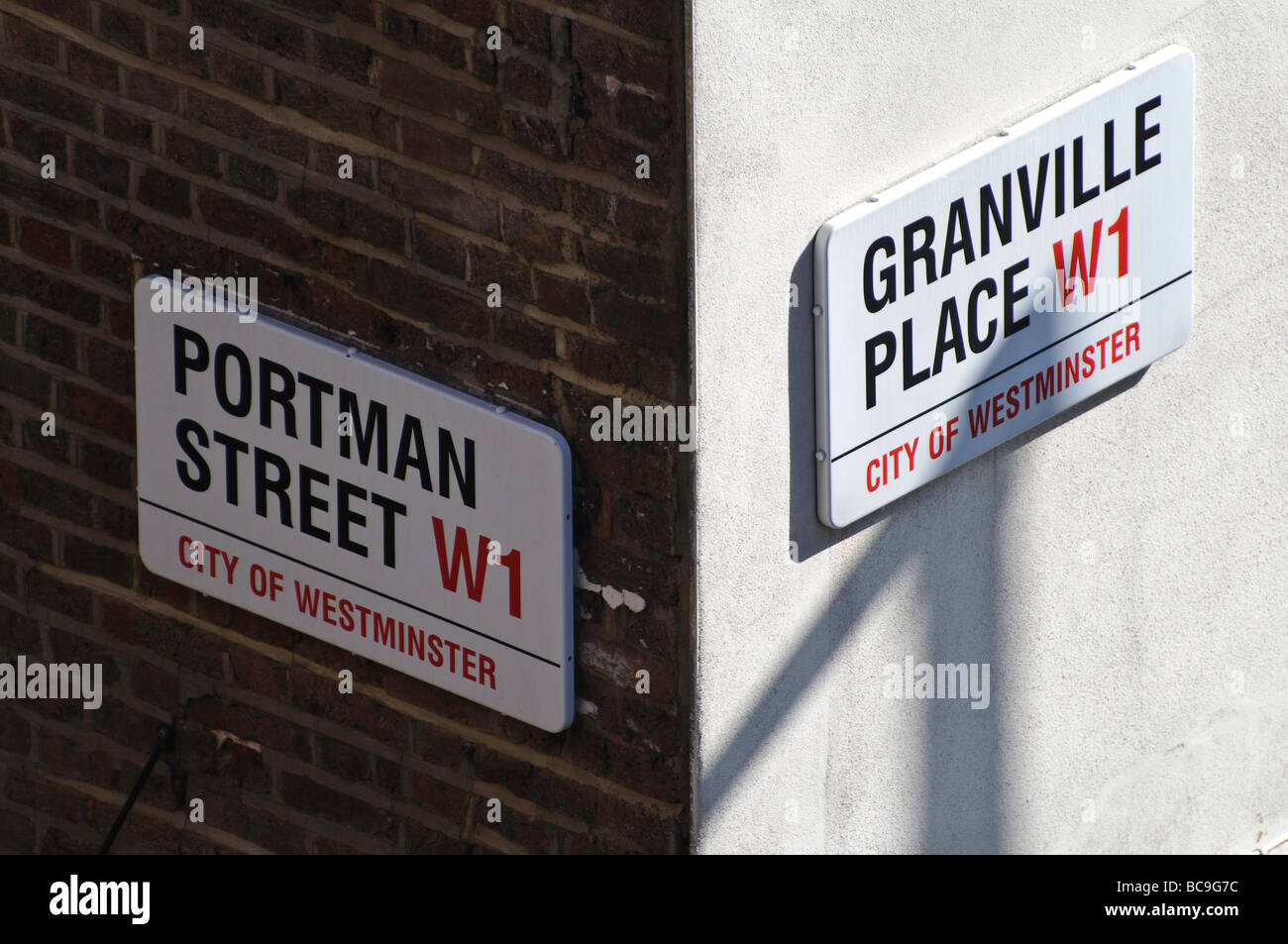 Street signs on the intersection of two London streets in the W1 ...
