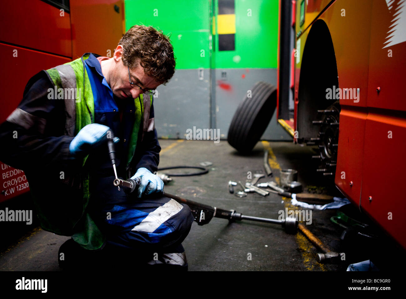 bus mechanic technician fix double decker London Stock Photo - Alamy