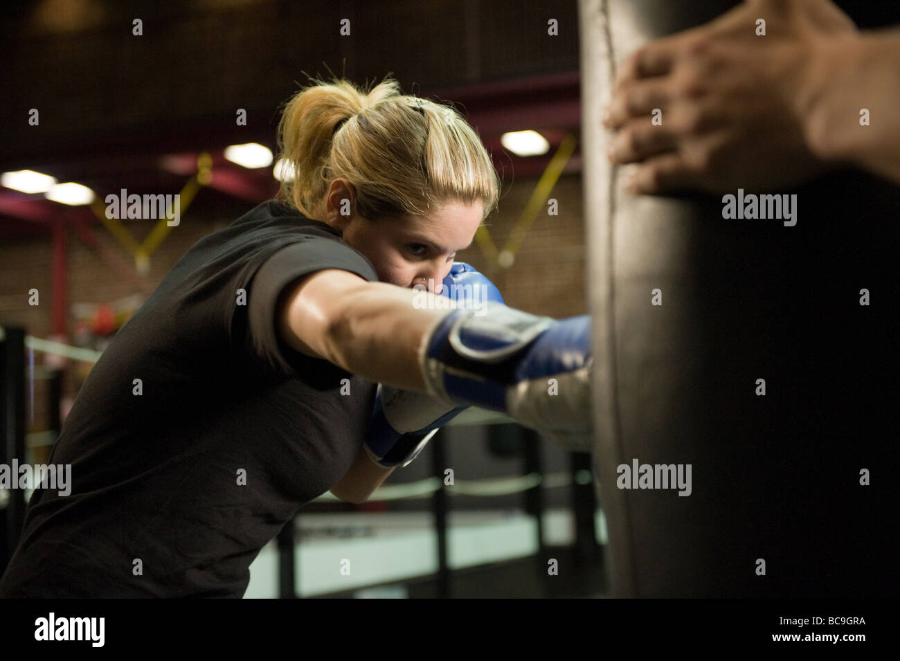 An action shot of a female boxer training Stock Photo - Alamy