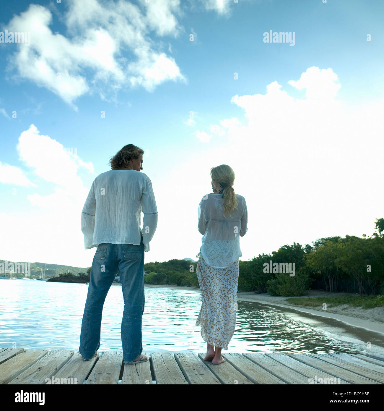 Couple on dock Stock Photo - Alamy