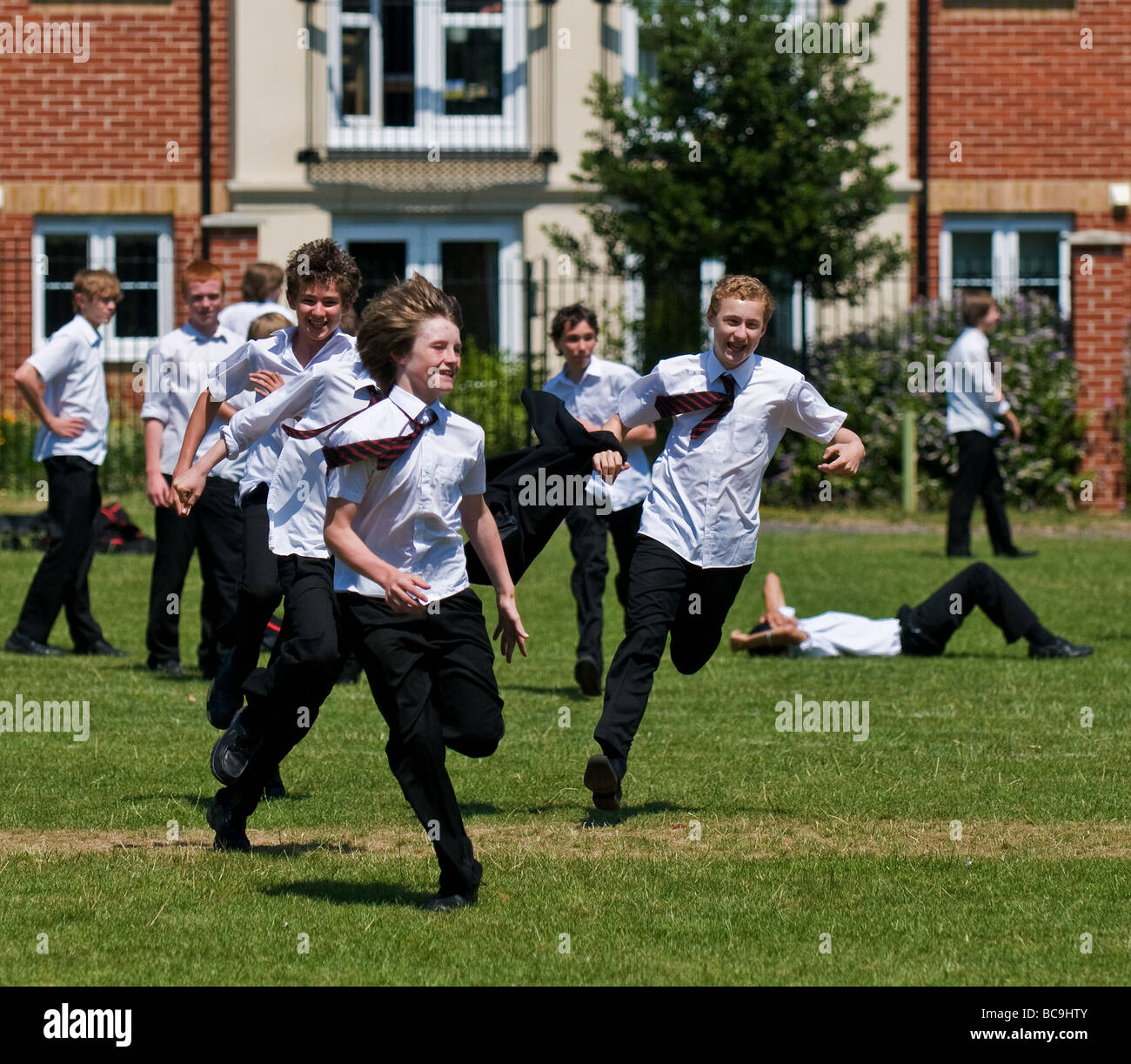 Schoolboys running and chasing each other. Photo by Gordon Scammell ...