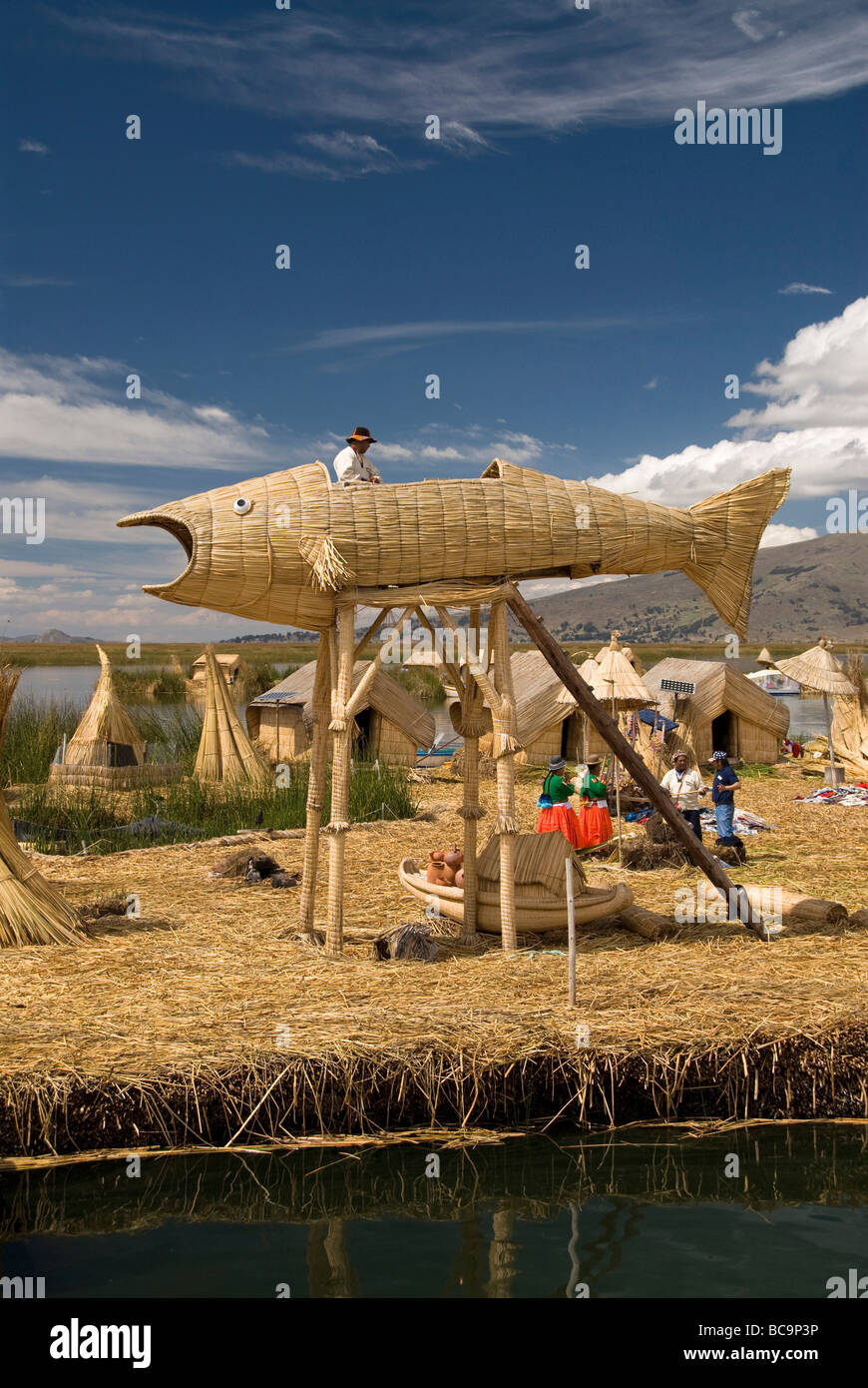 Peru Lake Titicaca the floating islands of the Uros people, man sitting ...