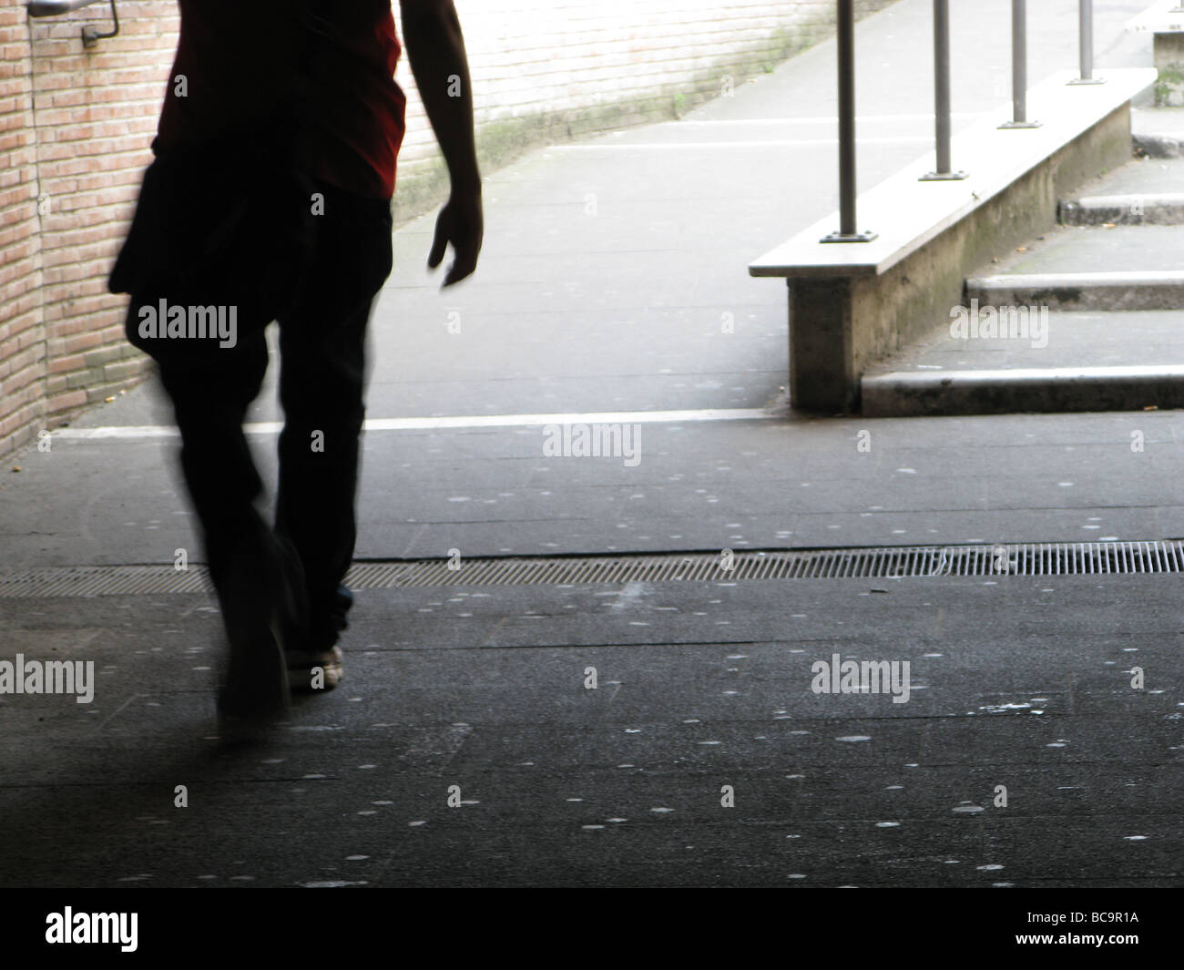 Woman walking alone in subway hi-res stock photography and images - Alamy