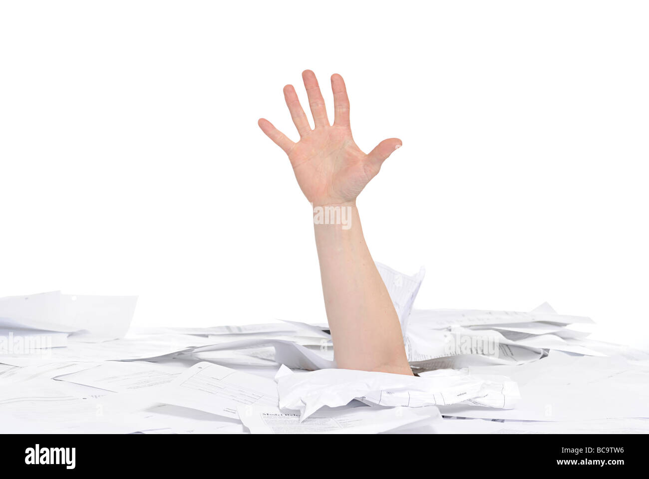 drowning person , hand sticking out af a desk full of papeers Stock ...